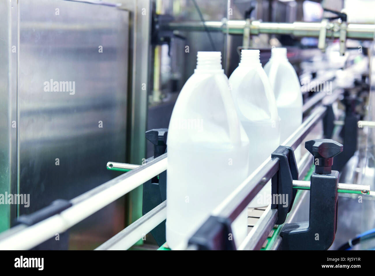 White plastic Bottles transfer on Automated conveyor systems industrial ...