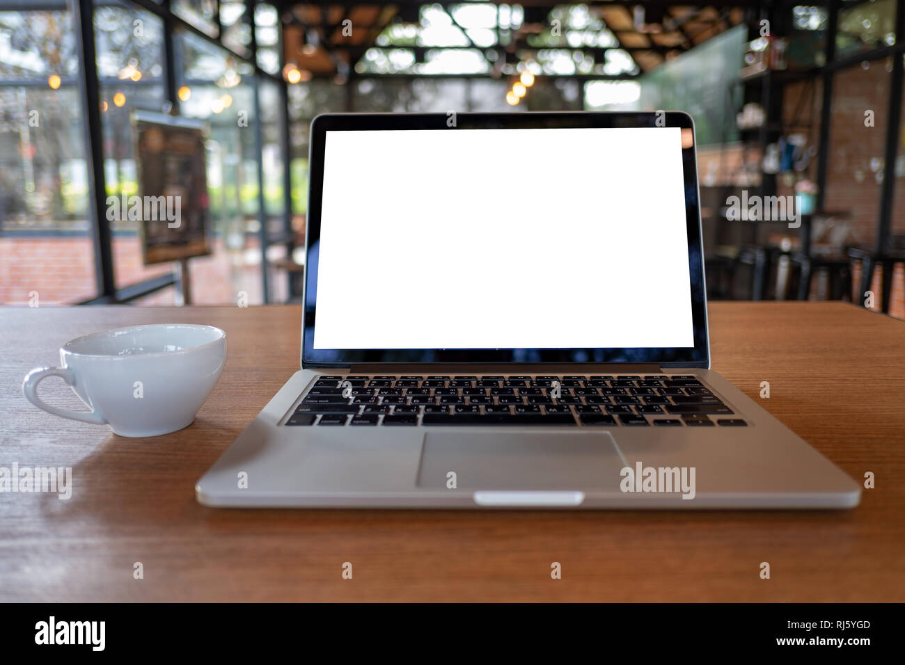 mock up Using laptop with blank screen computer modern Workspace in ...