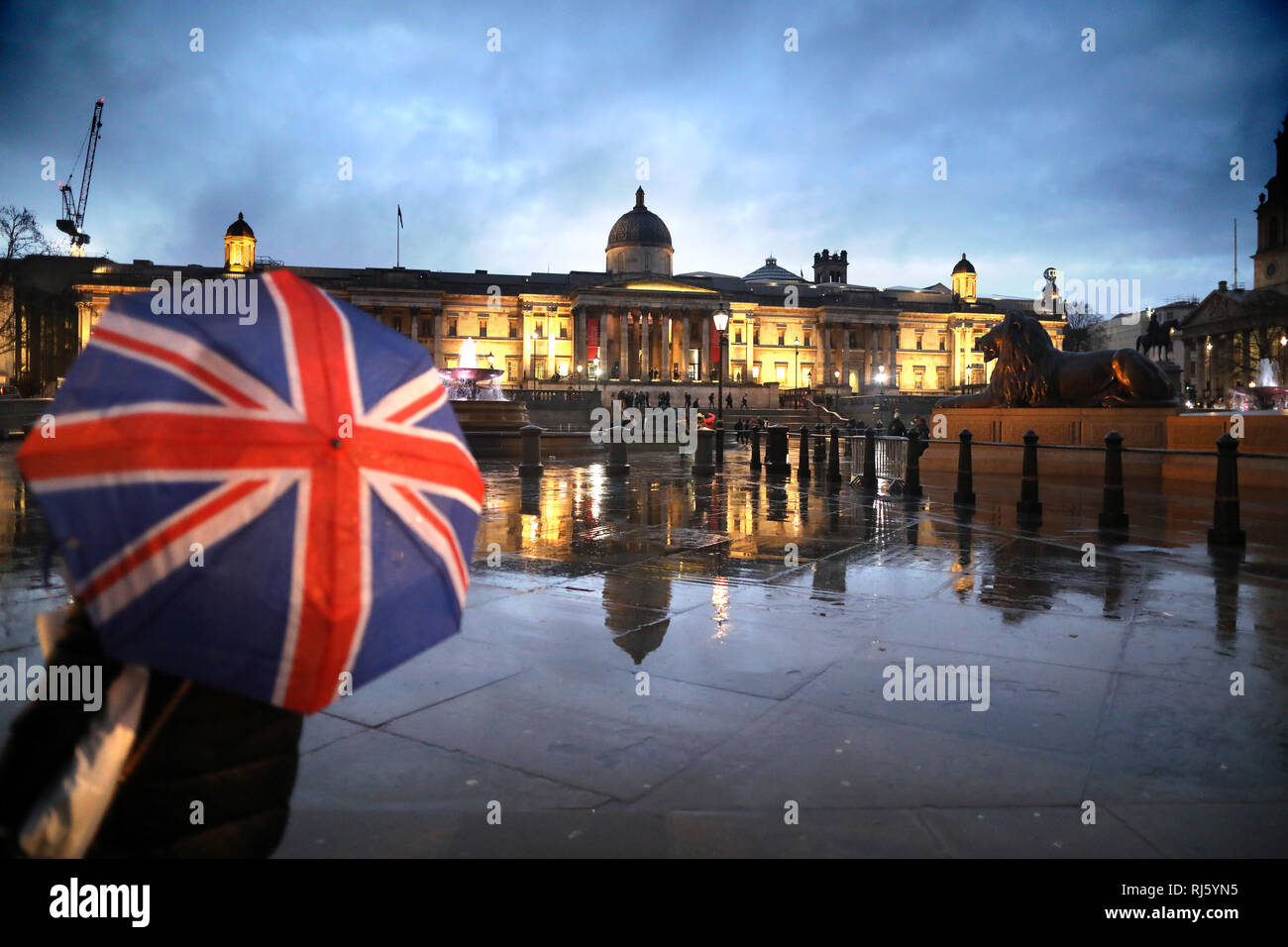 rainy day at Trafalgar Square with National Gallery in the background ...