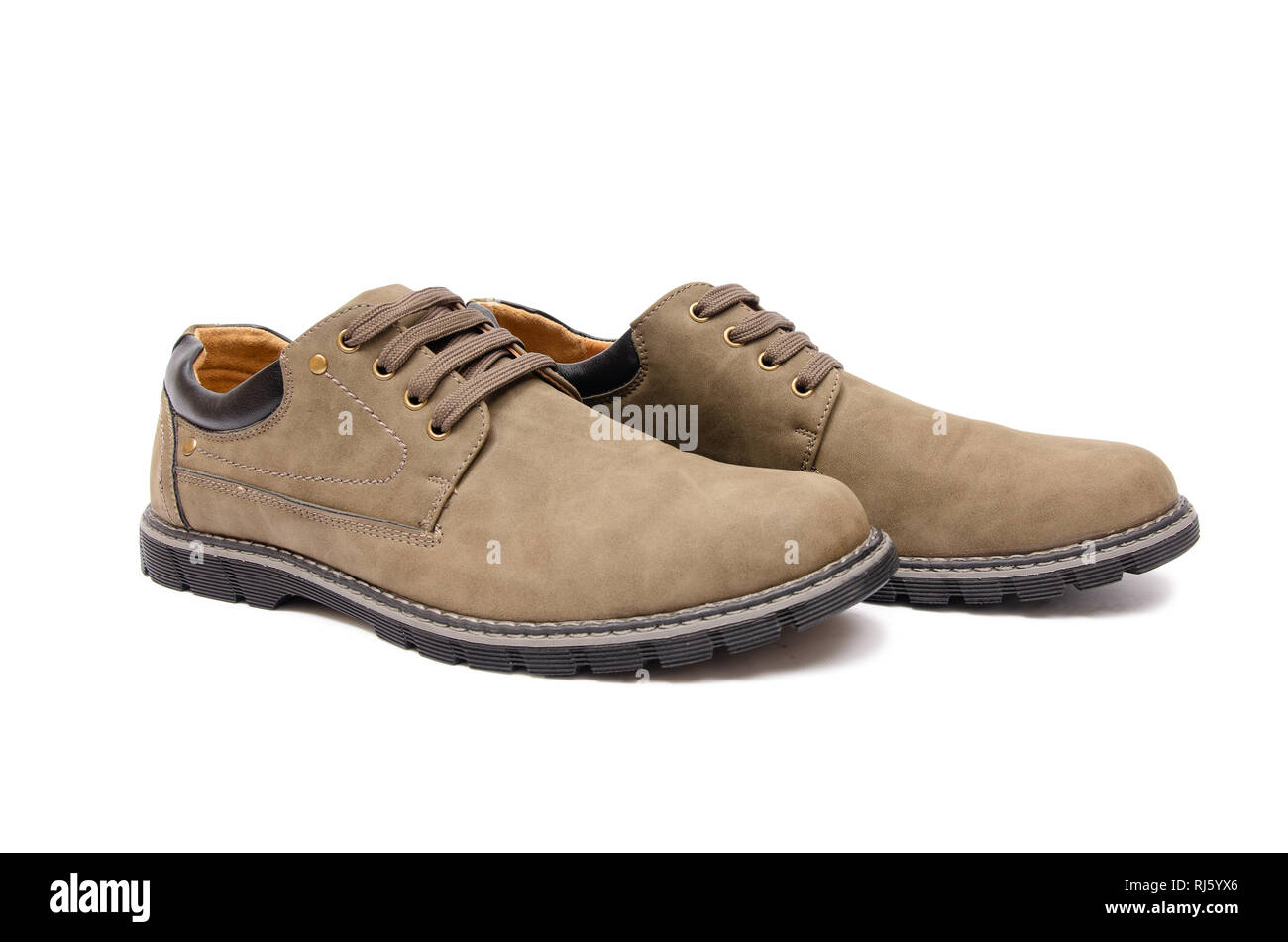 Brown suade shoes isolated on white background Stock Photo - Alamy