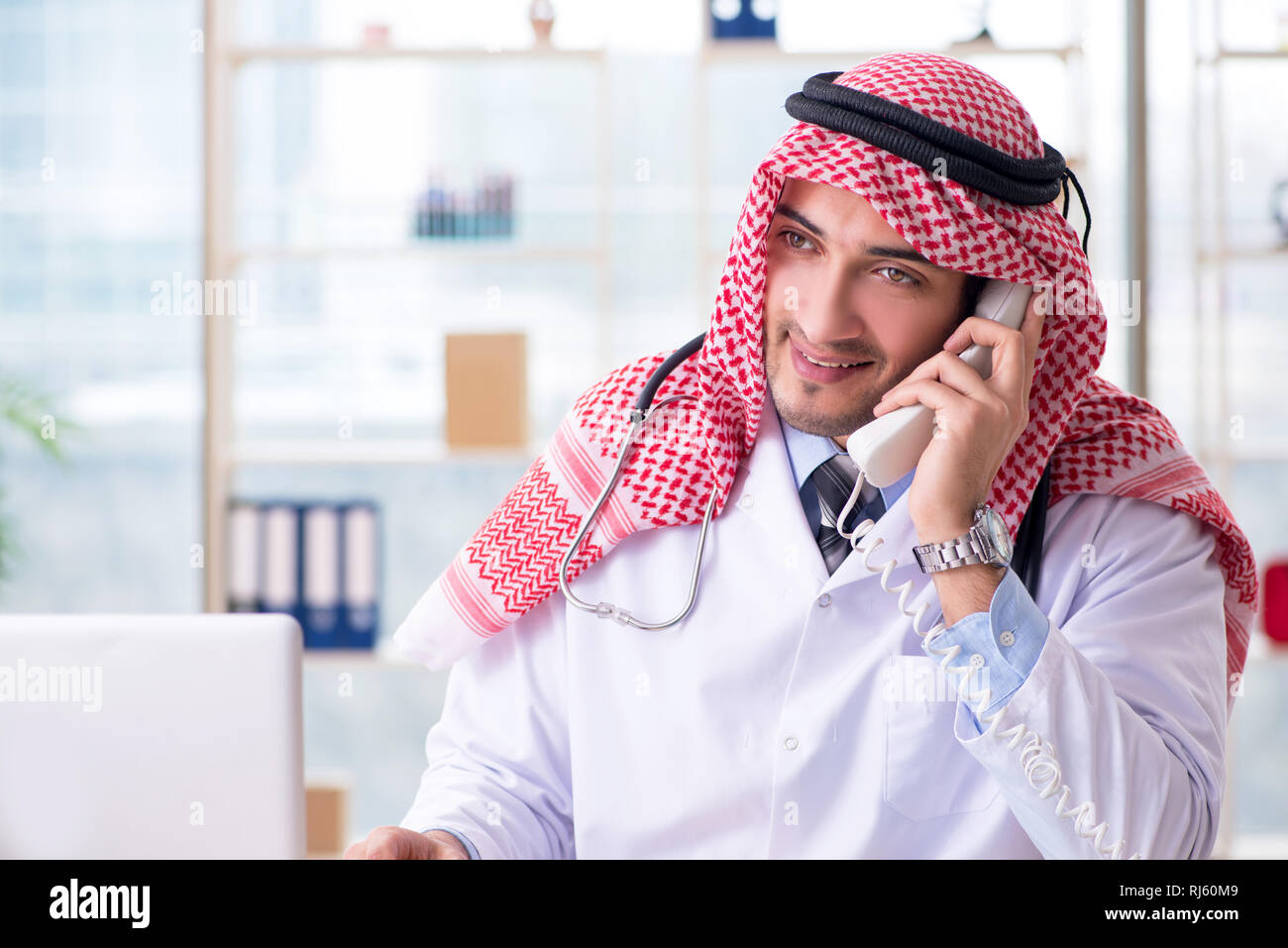 Arab doctor working in the clinic Stock Photo - Alamy