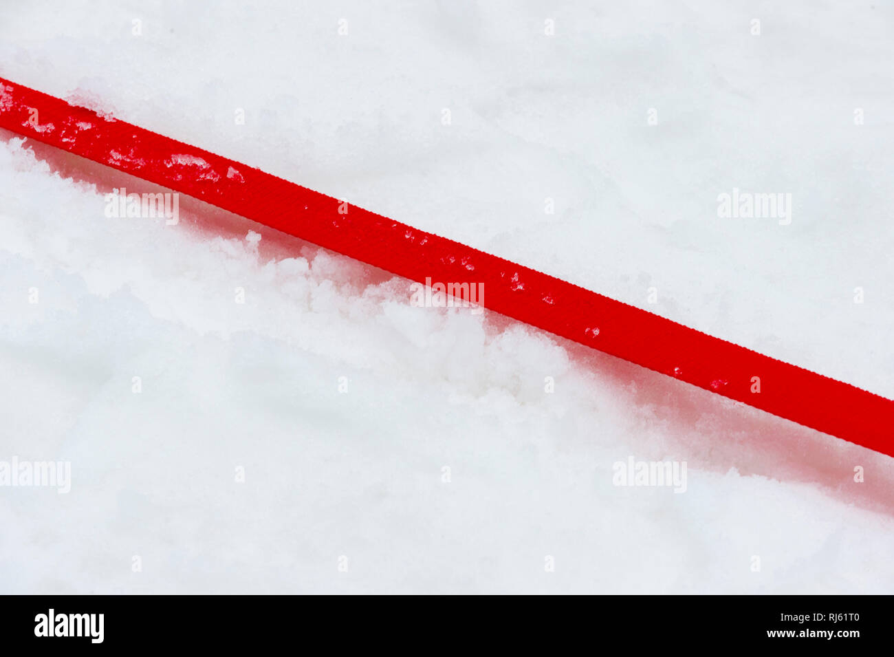 Snow volleyball court up close and in detail with red plastic line ...