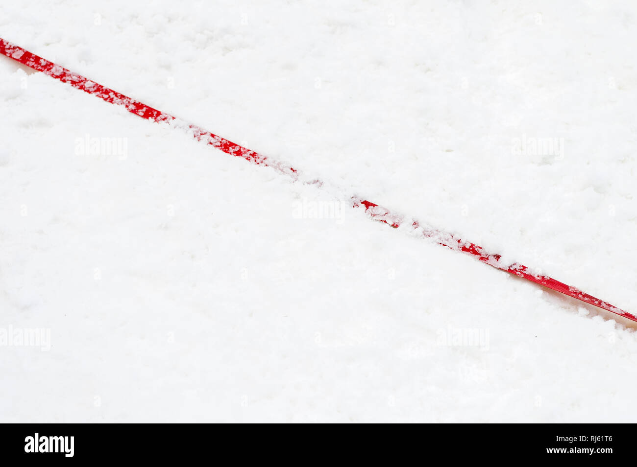 Snow volleyball court up close and in detail with red plastic line ...