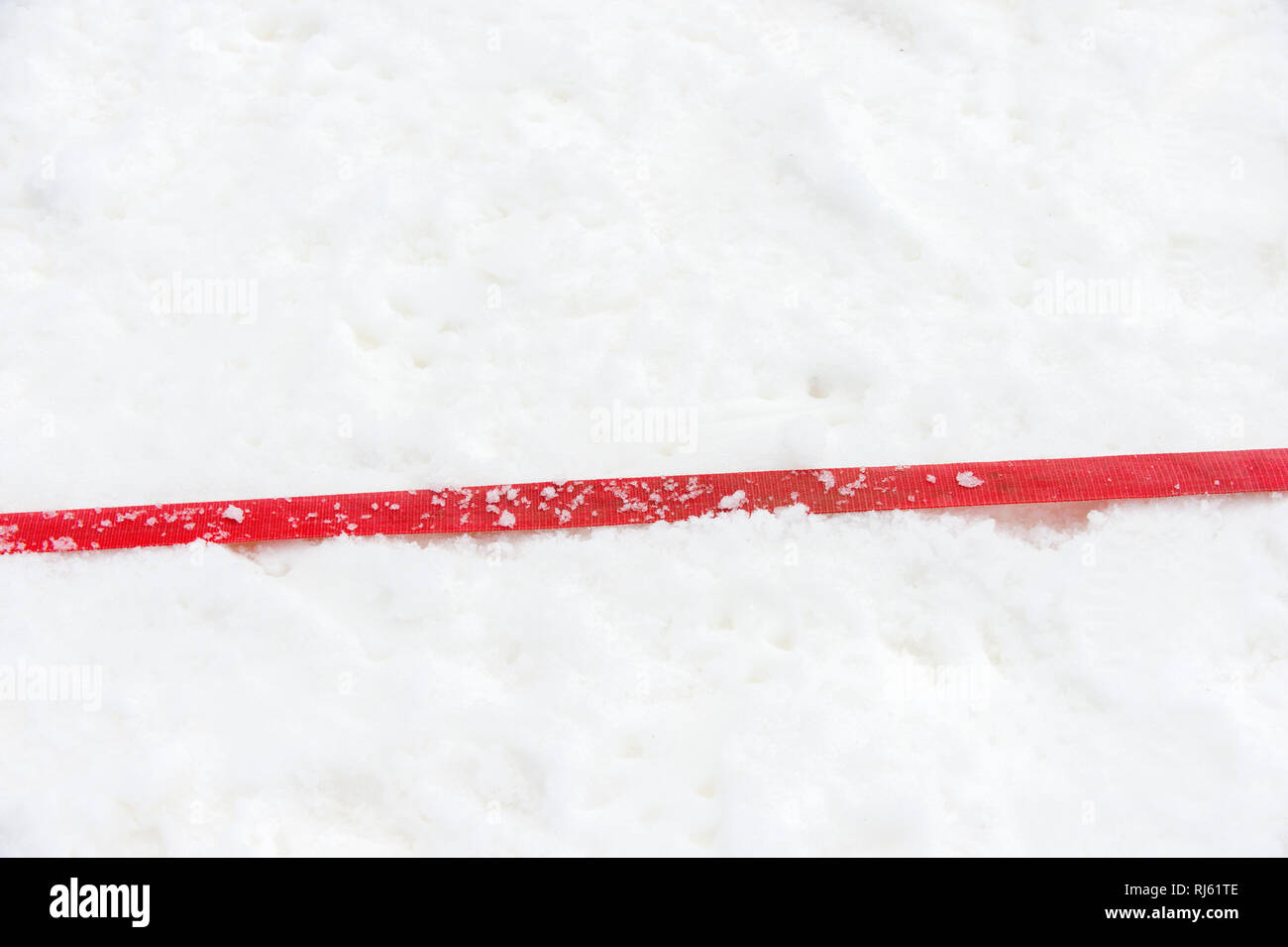 Snow volleyball court up close and in detail with red plastic line ...