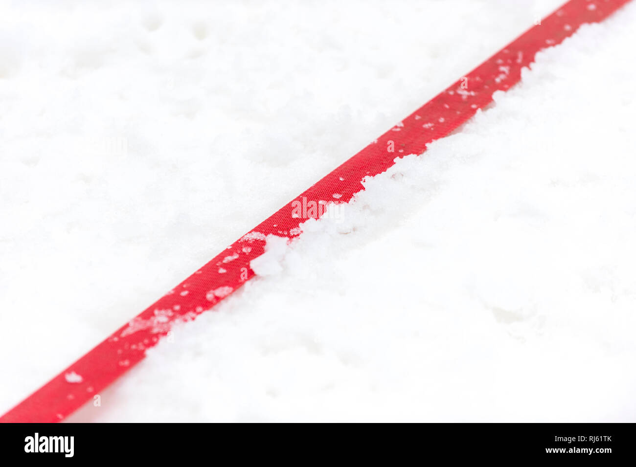 Snow volleyball court up close and in detail with red plastic line ...