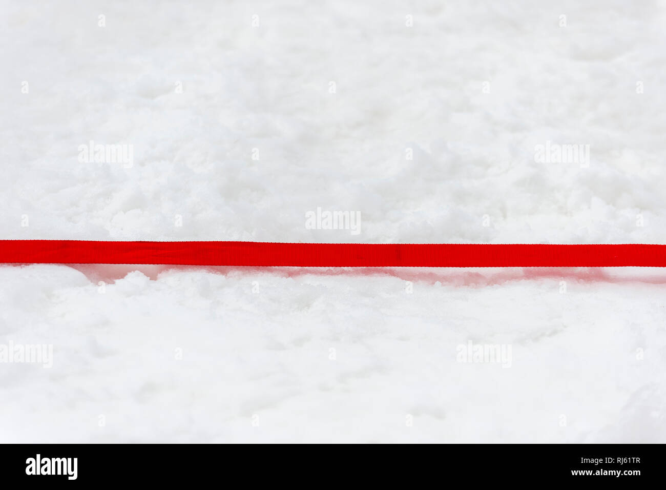 Snow volleyball court up close and in detail with red plastic line ...