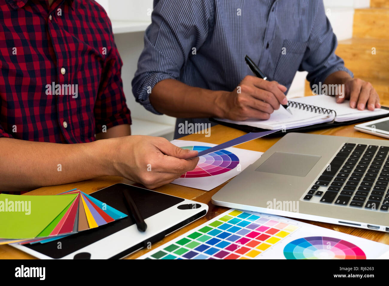 Graphic designers choose colors from the color bands samples for design ...