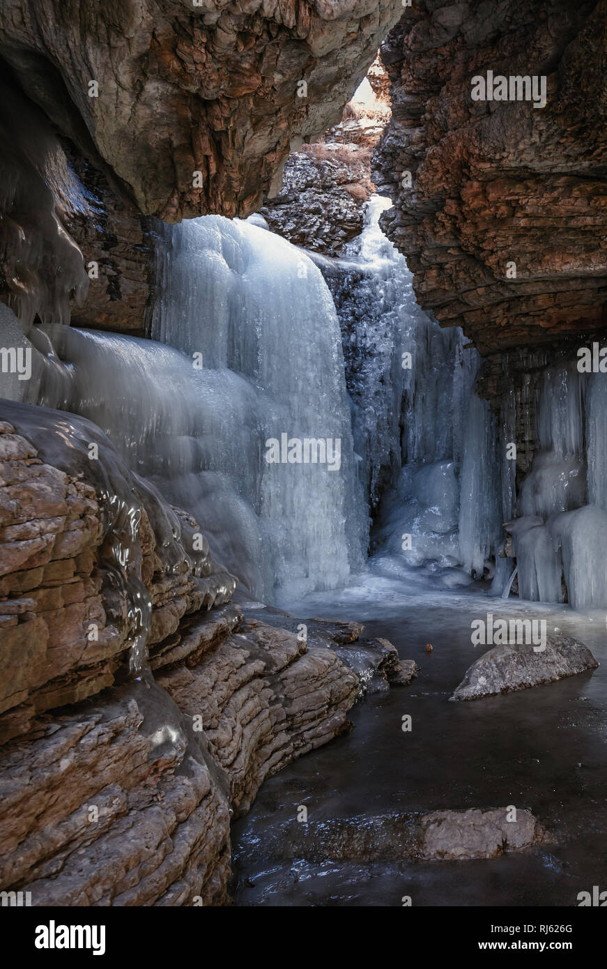 Frozen waterfall in a mountain gorge Stock Photo - Alamy