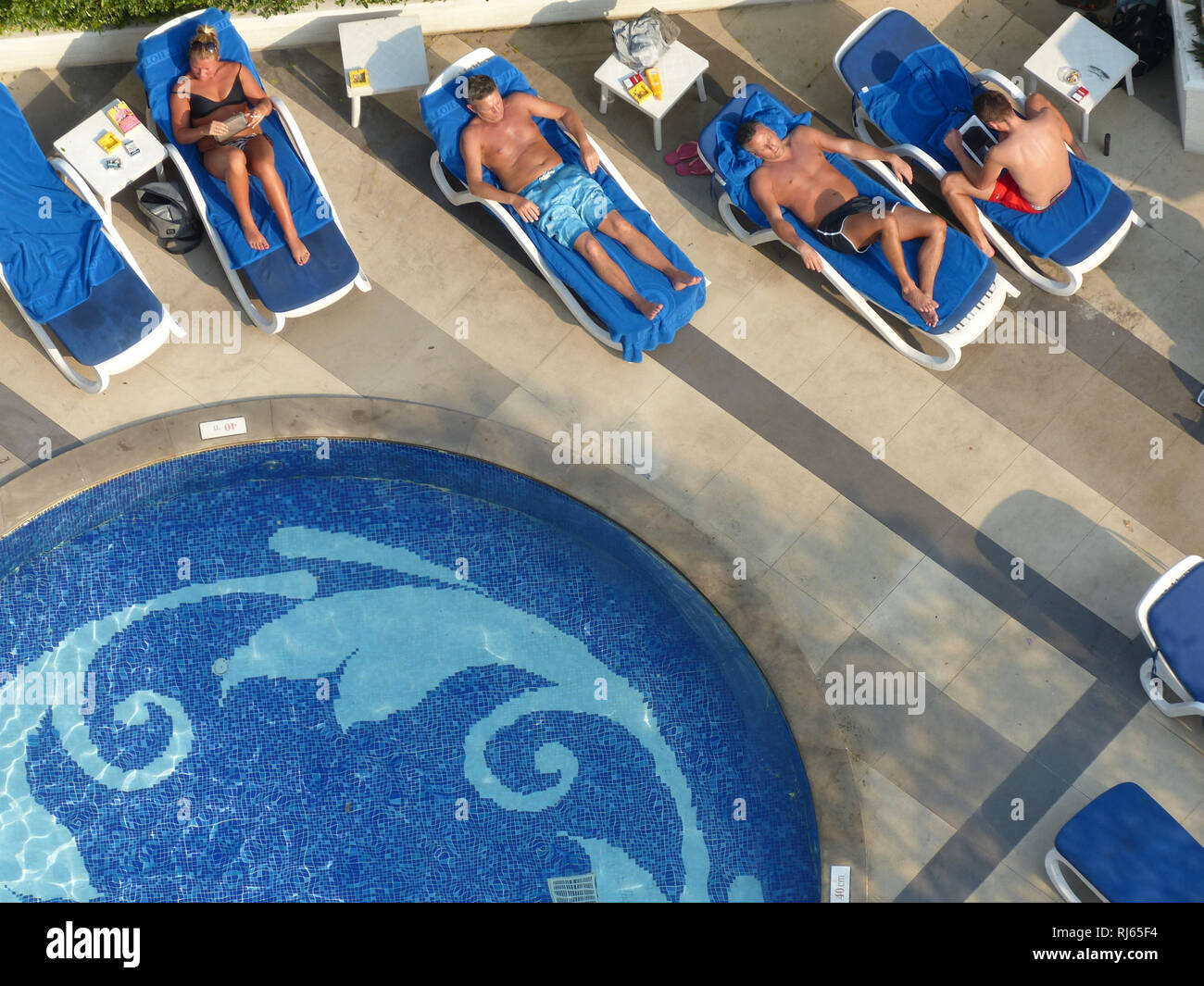 Prince Hotel swimming pool with sunbathing guests Stock Photo - Alamy