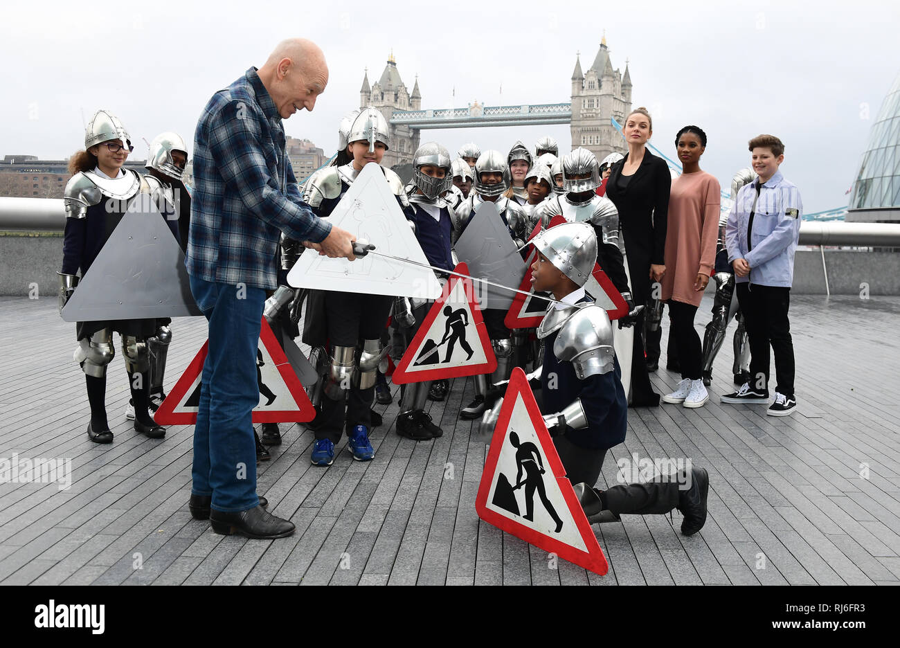 Rebecca Ferguso, Rhianna Dorriss, and Louis Ashbourne Serkis look on as ...