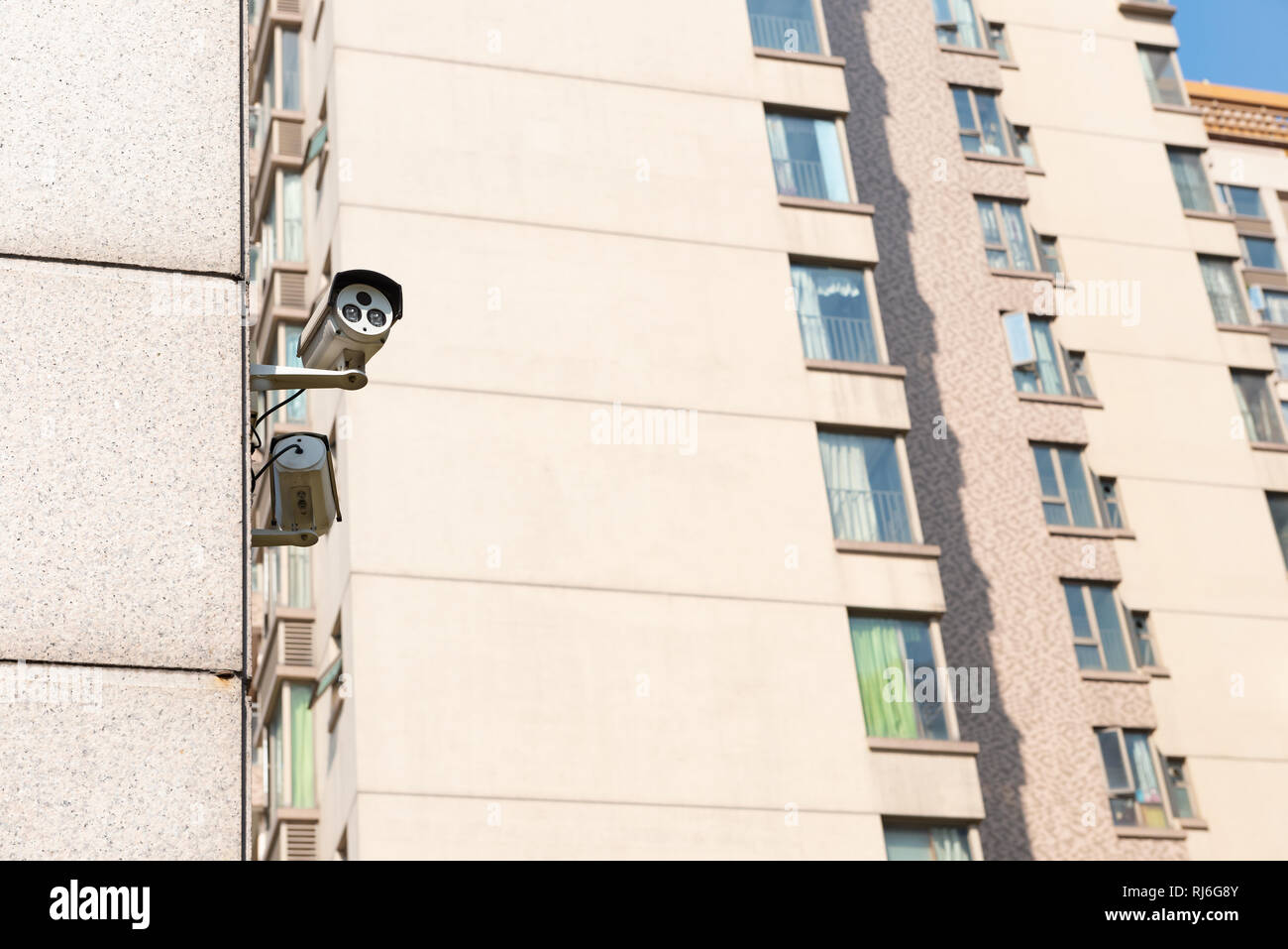 CCTV camera in front of a residential building Stock Photo - Alamy
