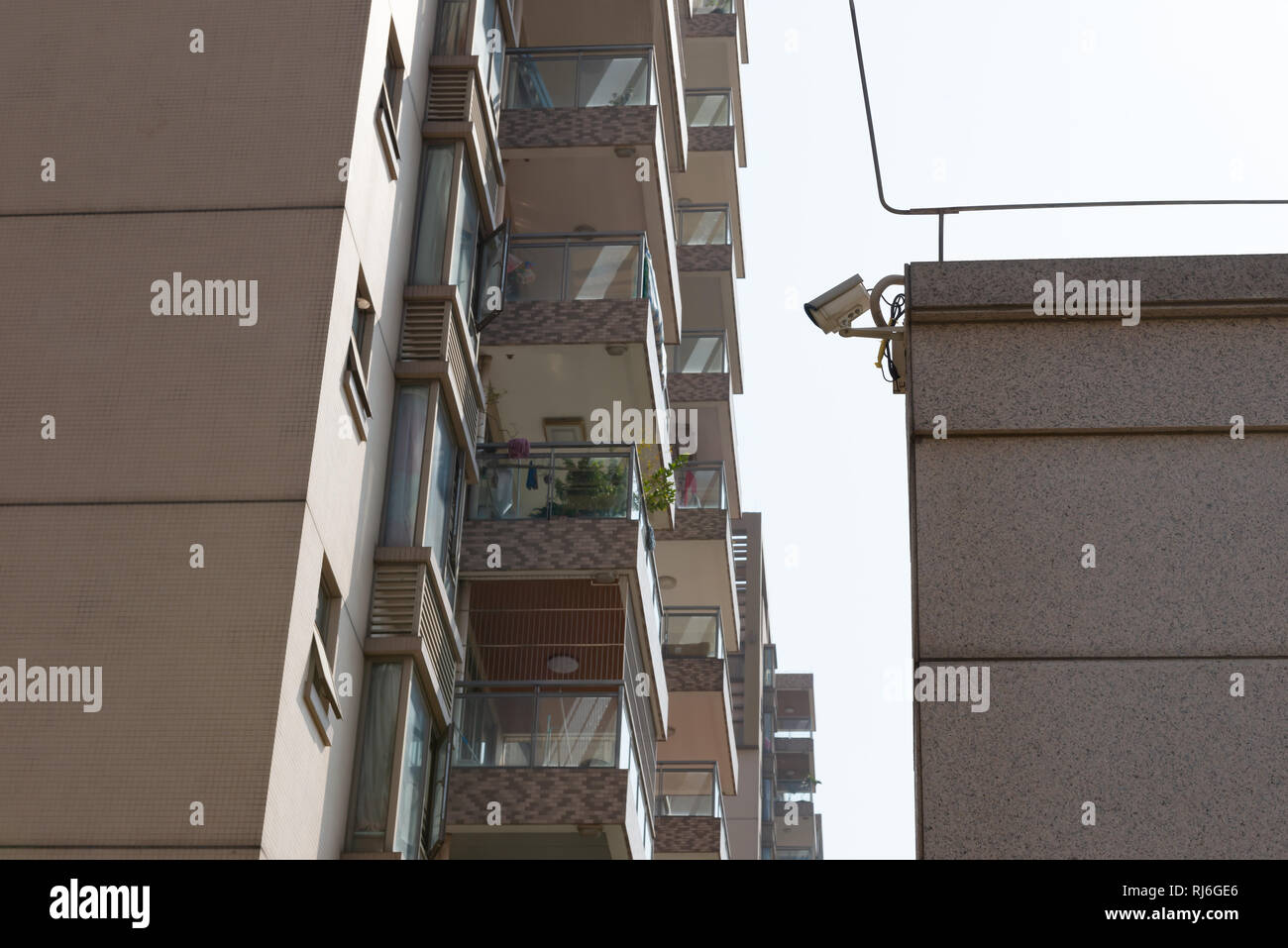 CCTV camera in front of a residential building Stock Photo - Alamy