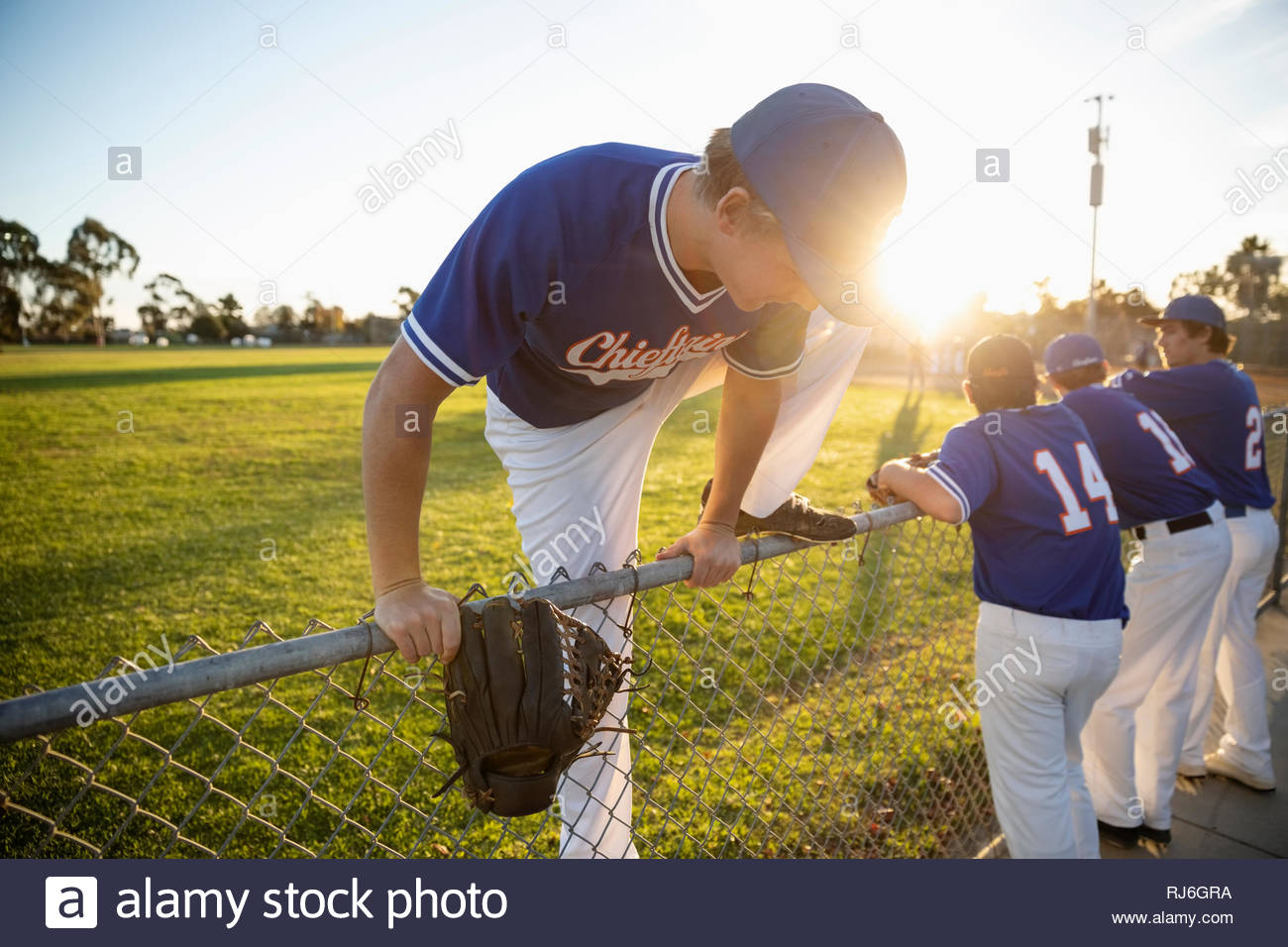 Climbing Over Fence Stock Photos & Climbing Over Fence Stock Images - Alamy