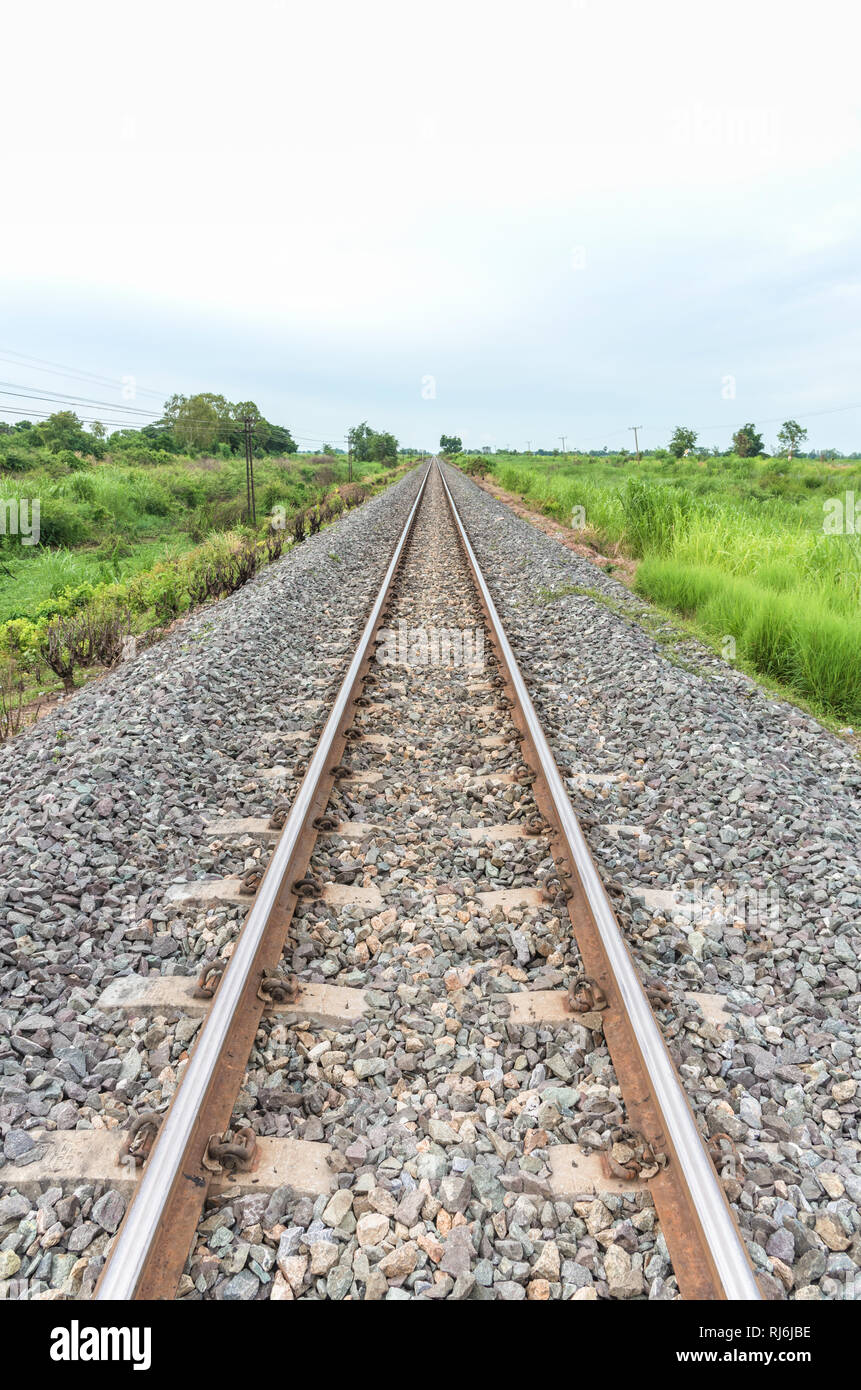Long straight railroad on concrete sleepers in a rural Stock Photo - Alamy