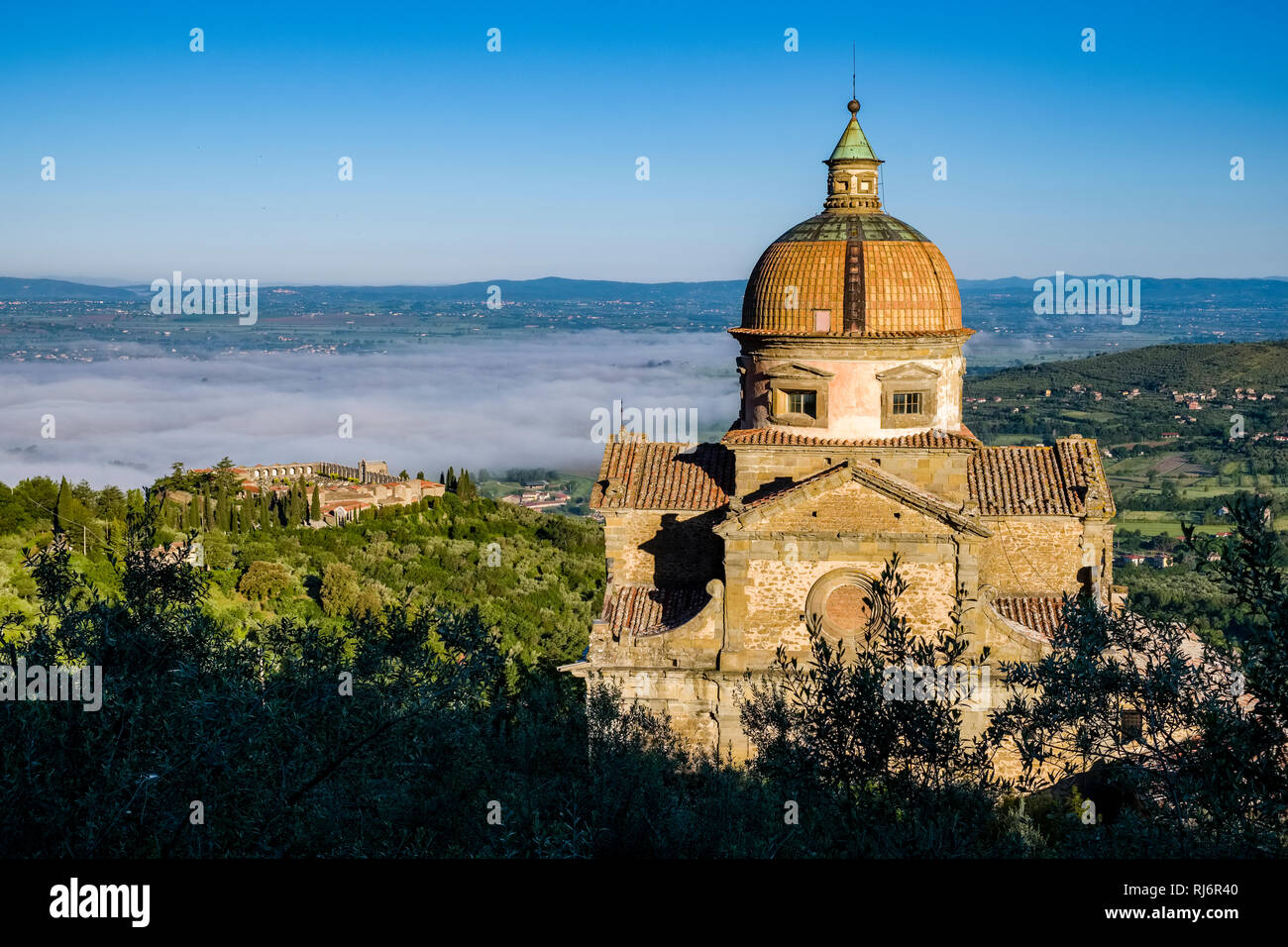 Typical hilly Tuscan countryside with the Church of Santa Maria Nuova ...