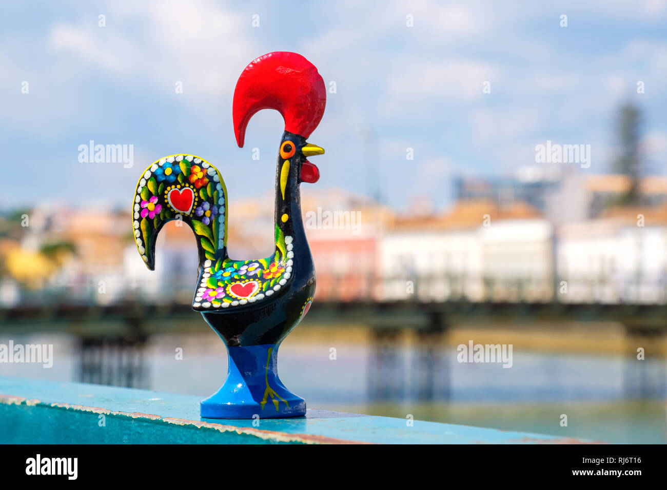 Rooster of Barcelos (Galo de Barcelos) on a quay of river Gilao. Tavira ...
