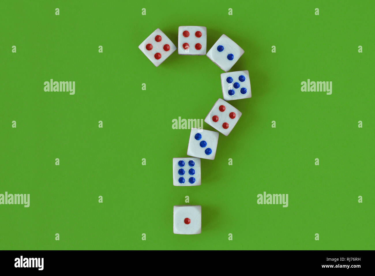 Question mark made of dices on green background - Concept of chance and ...