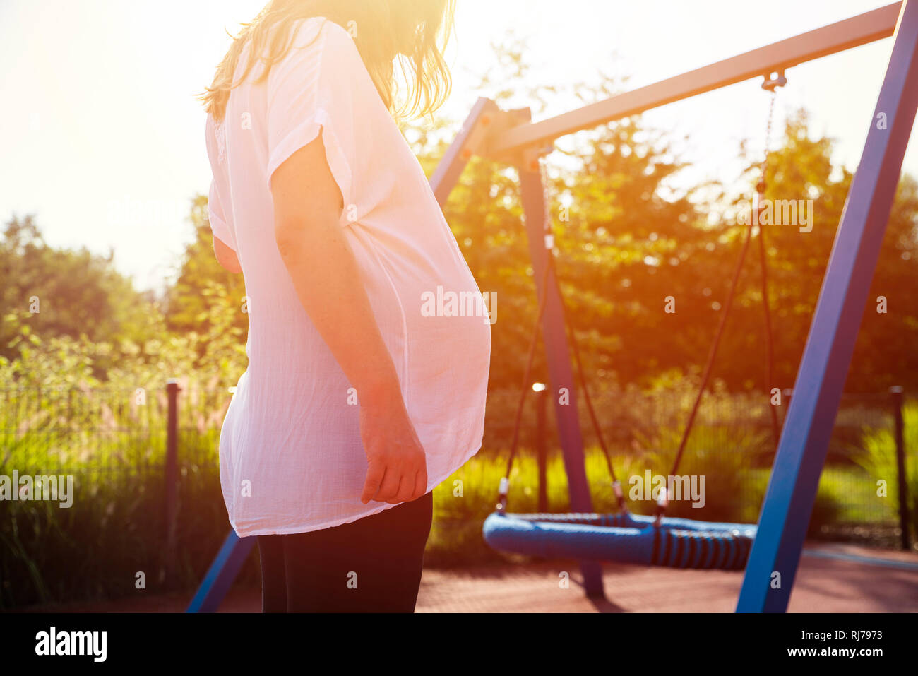 lonely pregnant woman on the playground Stock Photo - Alamy
