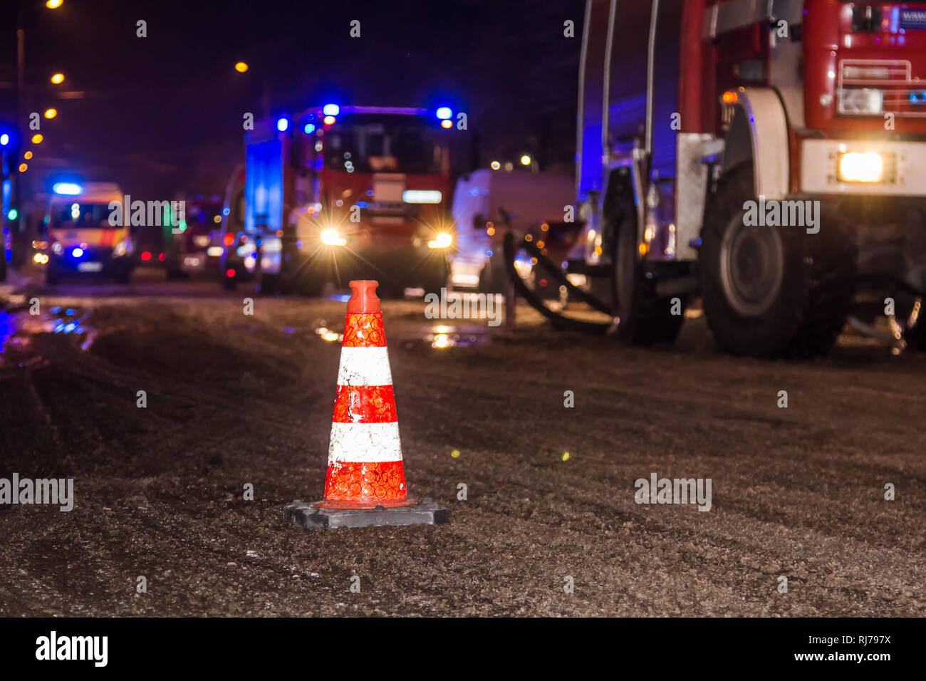 a cone on the road during the fire extinguishing in the winter in the ...