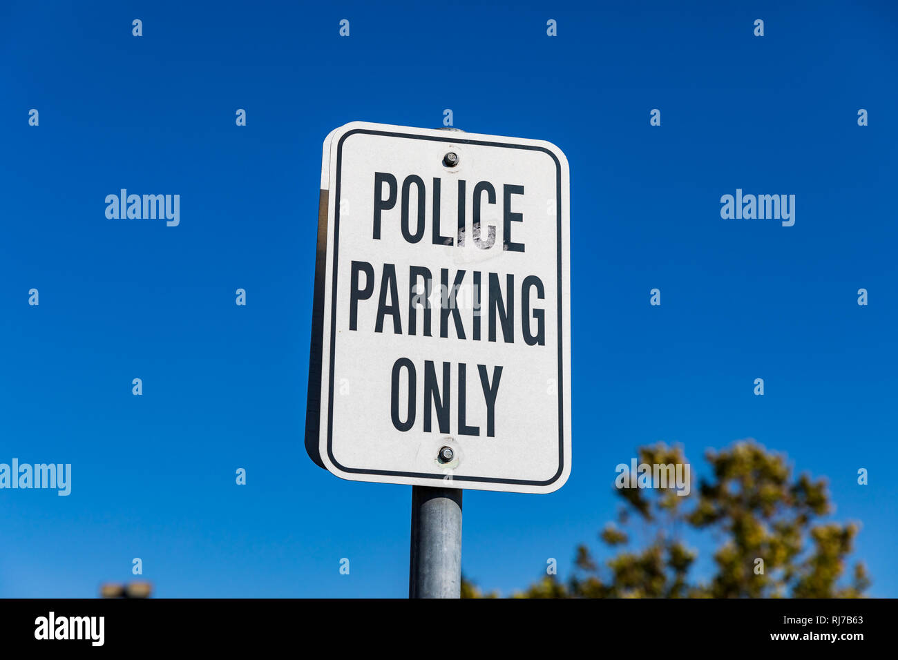 Police Parking Only, sign against blue sky (California, USA Stock Photo ...