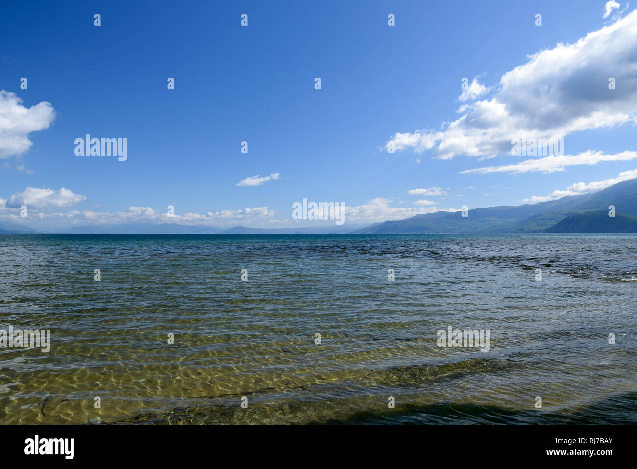 Landscape of Ohrid lake with mountain background. Pogradec, Tushemisht ...