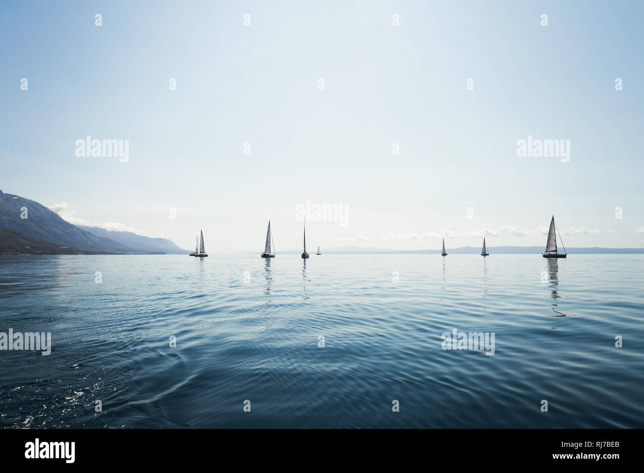 Portrait of sailing boats on open sea Stock Photo - Alamy