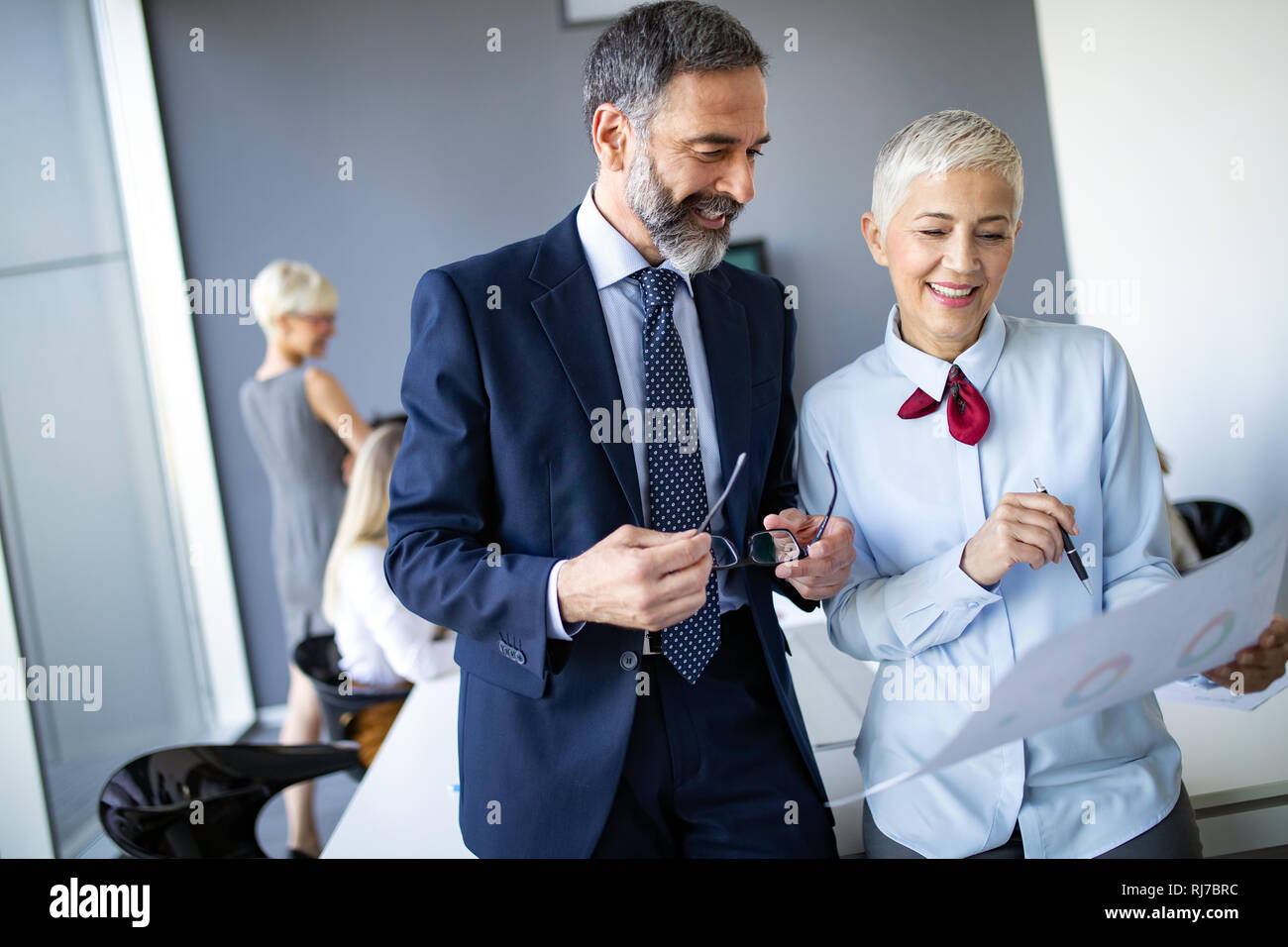 Collaboration and analysis by business people working in office Stock ...