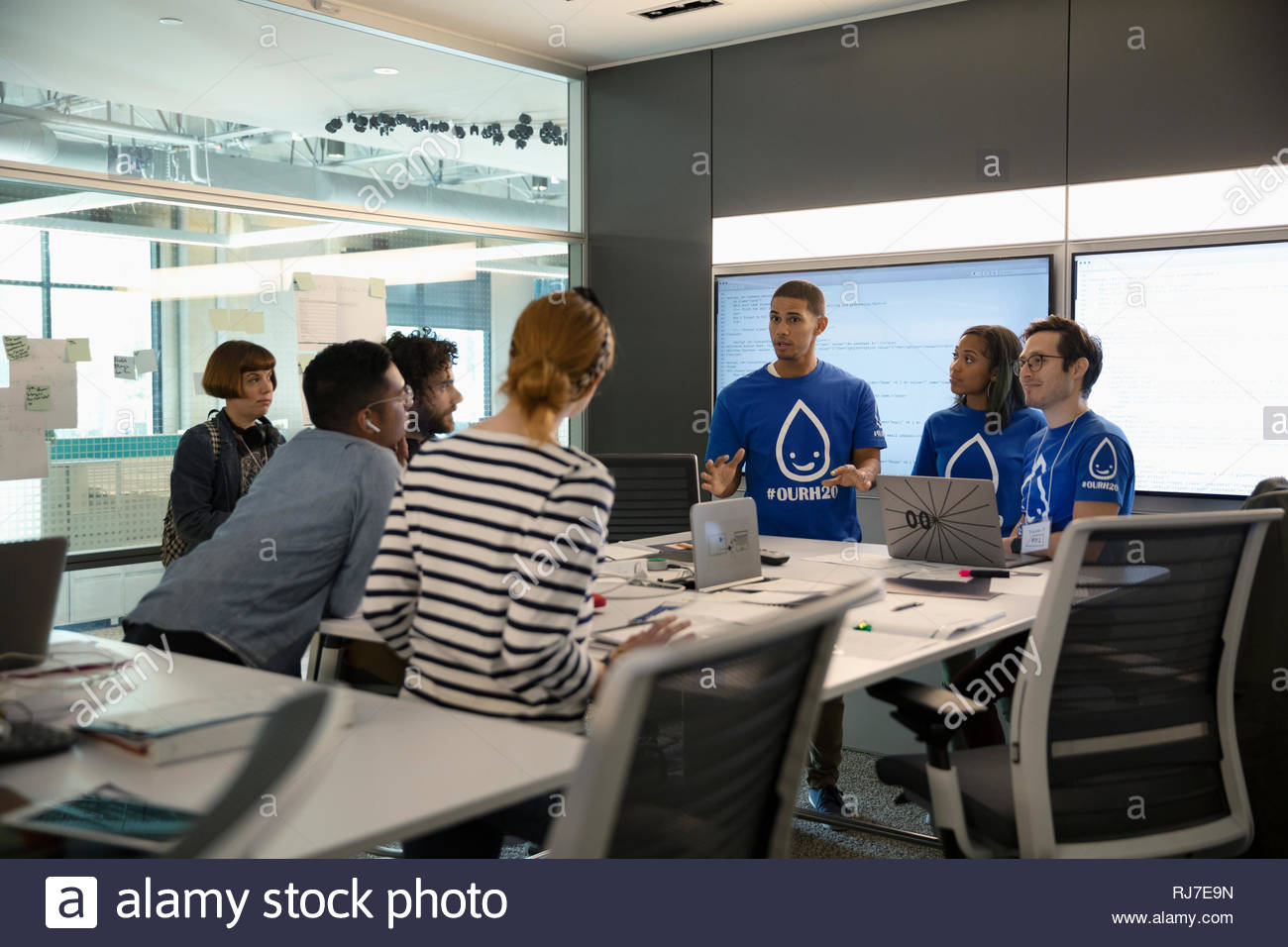 Millennial entrepreneurs strategizing in conference room Stock Photo ...