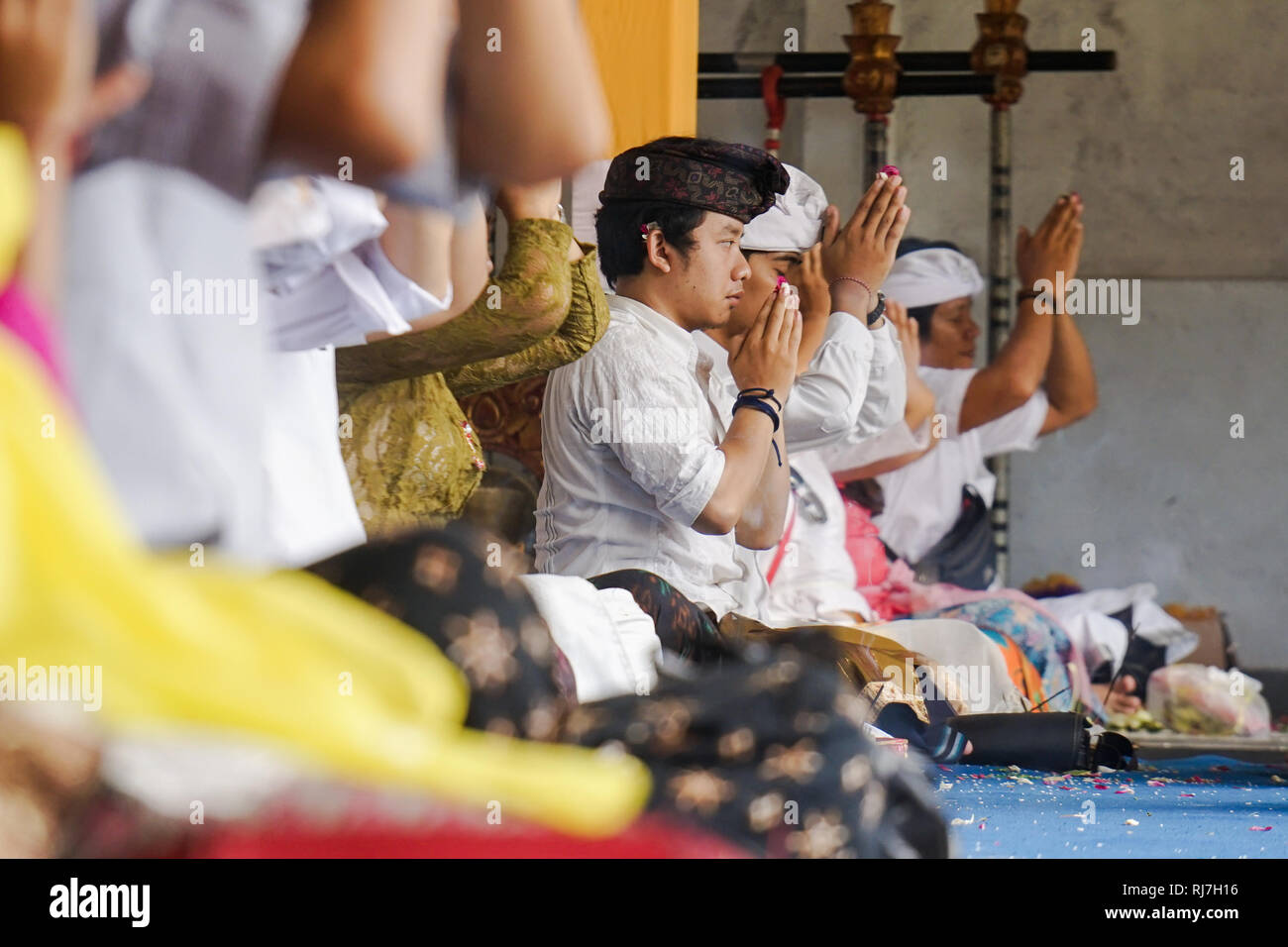 Hindu people praying during Galungan ceremony at Pura Jagatnatha ...