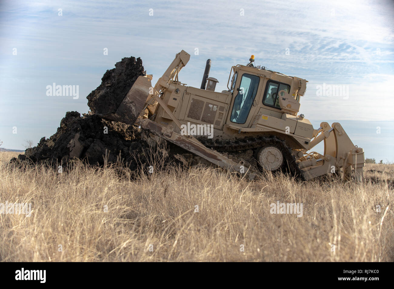 A bulldozer from the 8th Engineer Battalion, 2nd Armored Brigade Combat ...