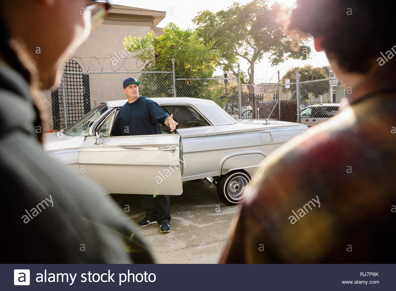 Man standing by car door hi-res stock photography and images - Alamy
