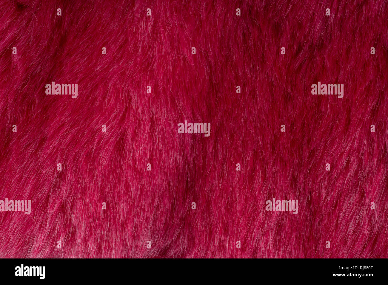 Red faux fur textured background Stock Photo - Alamy