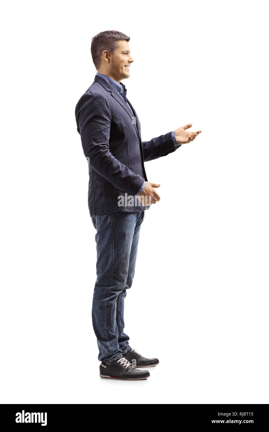 Full length profile shot of a young man standing and gesticulating a ...