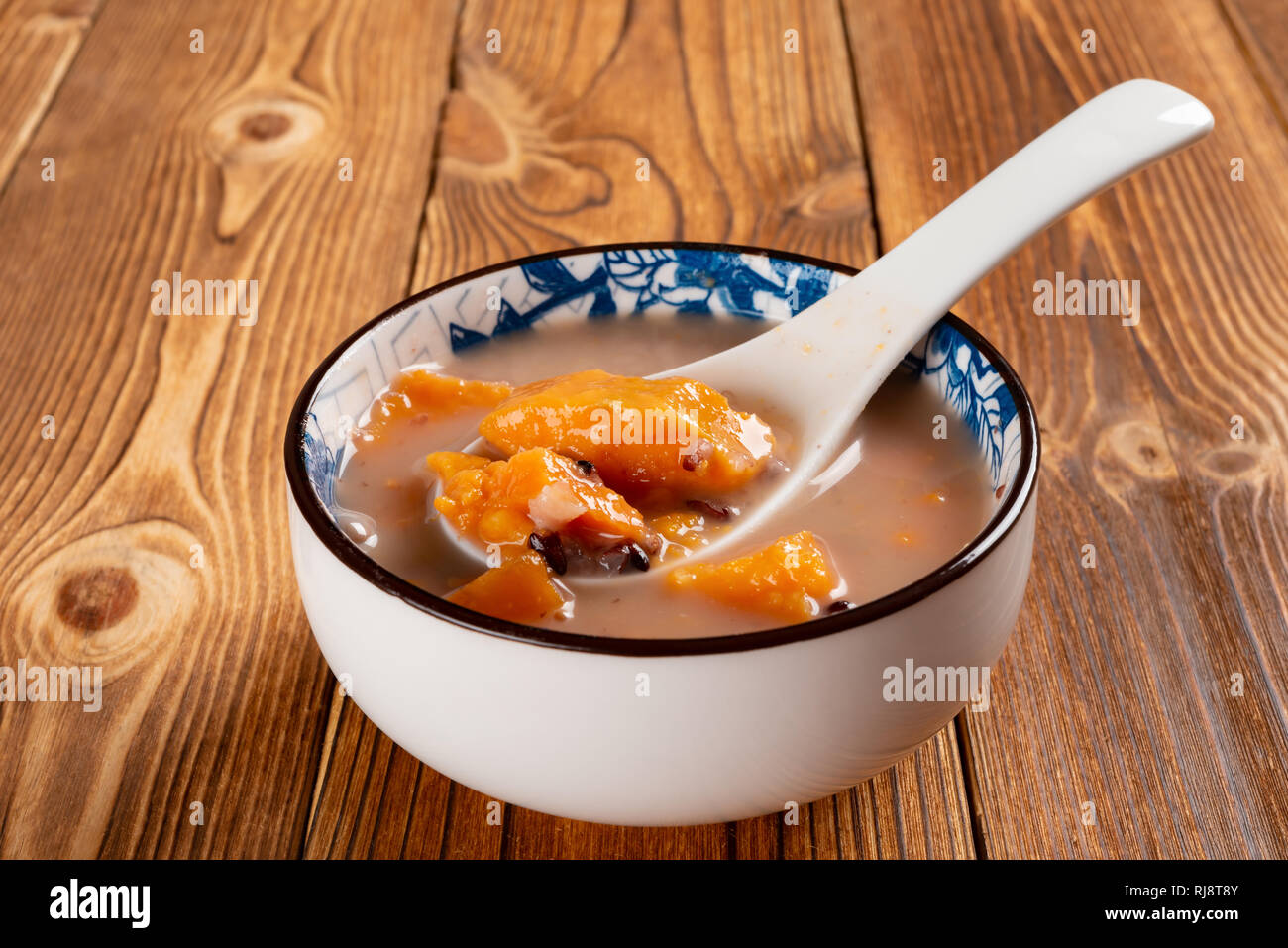 side view Chinese syrup of sweet potato and purple rice with lily bulbs ...