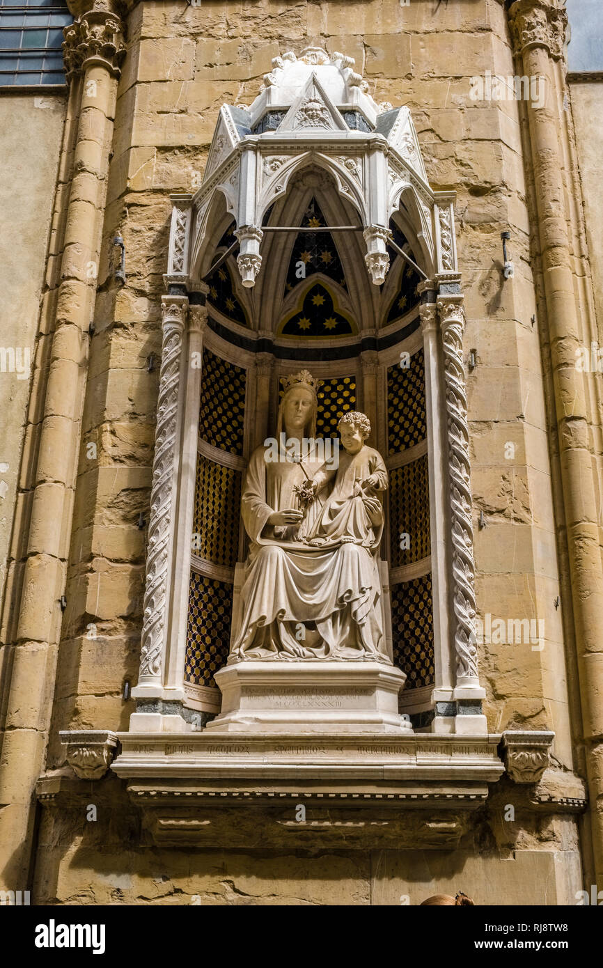 Rock carved sculptures included in the facade of a building Stock Photo ...