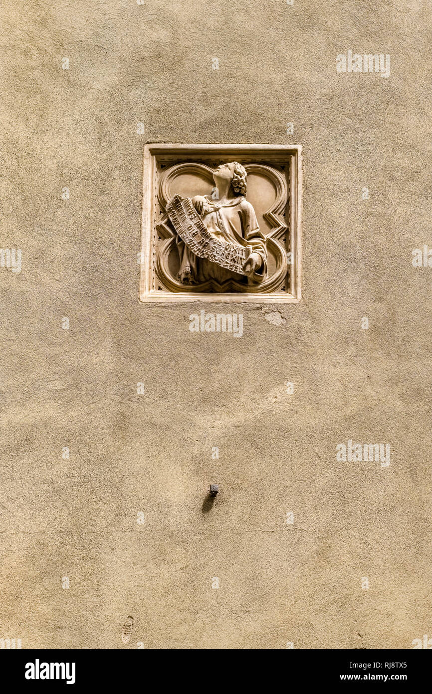 Rock carved sculptures included in the facade of a building Stock Photo ...