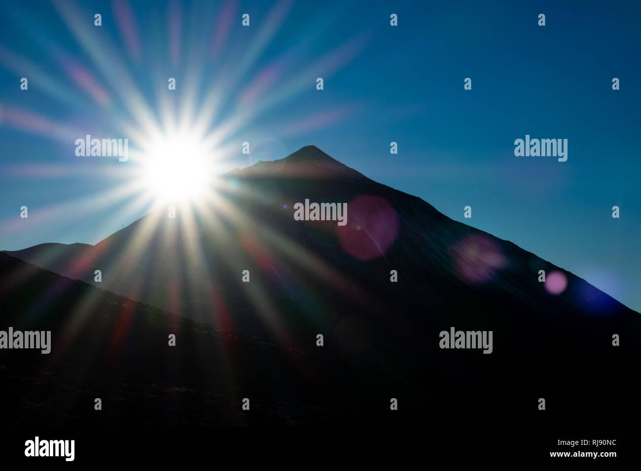 Blue sky and sun star in the back light hi-res stock photography and ...