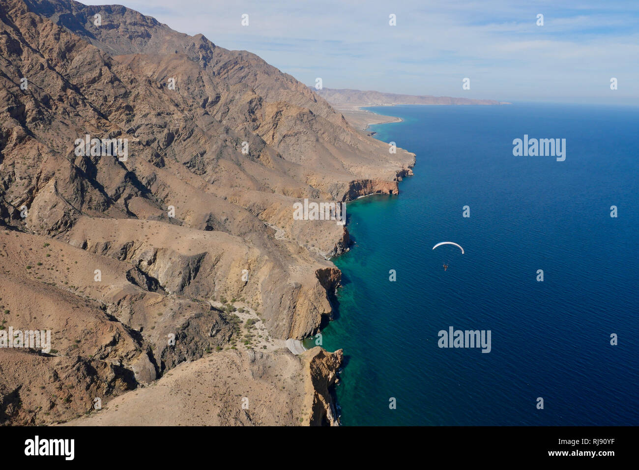 paramotor pilots flying the coast of Oman Stock Photo - Alamy