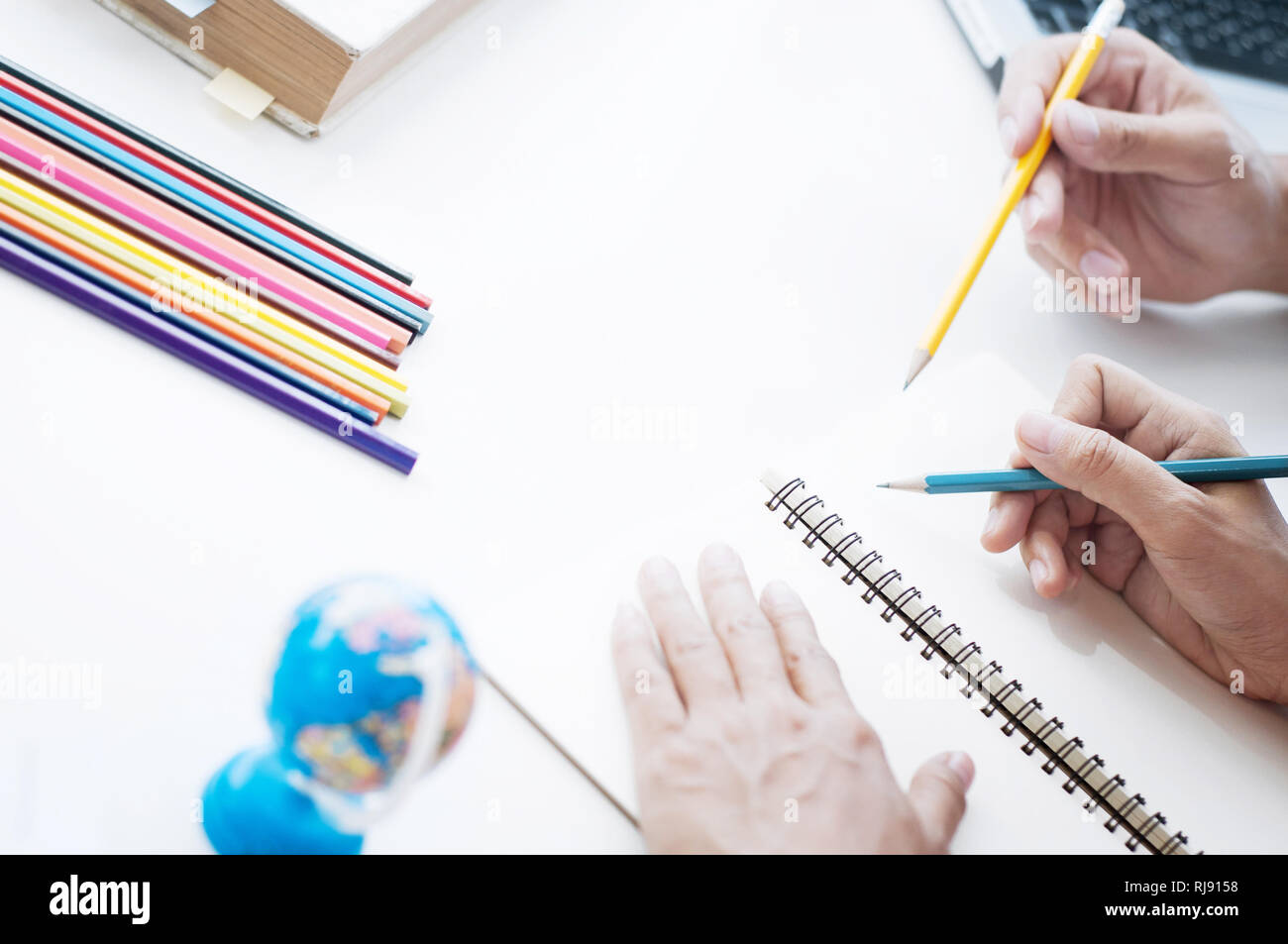 Two male students working together hi-res stock photography and images ...