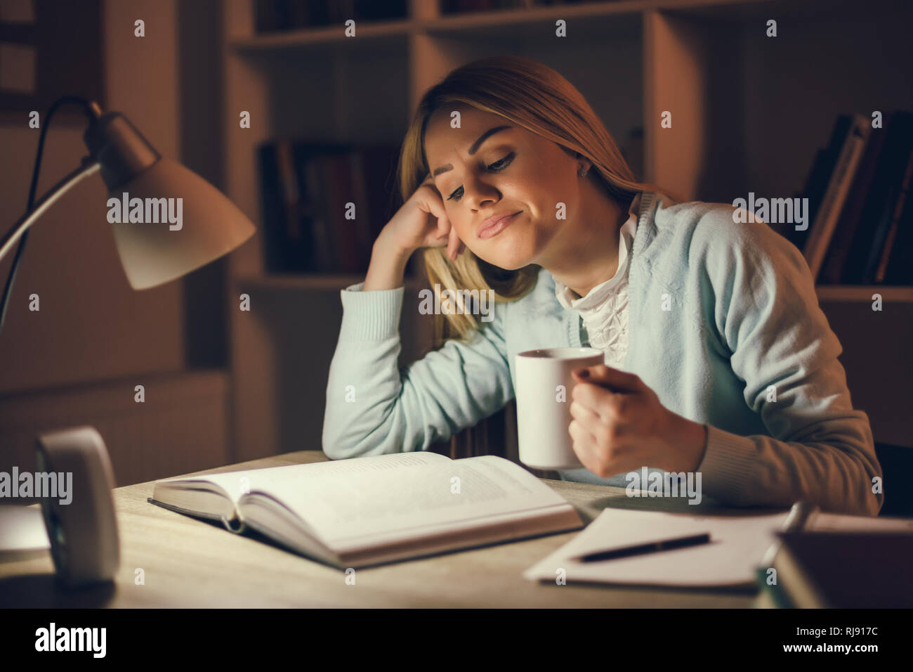 Tired student learning at home Stock Photo - Alamy