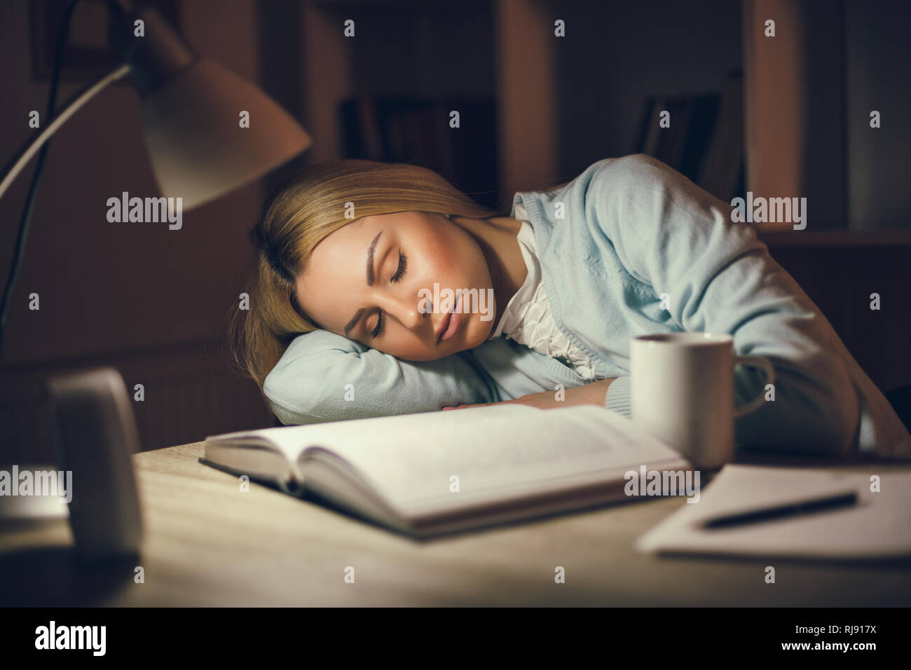 Tired student learning at home Stock Photo - Alamy