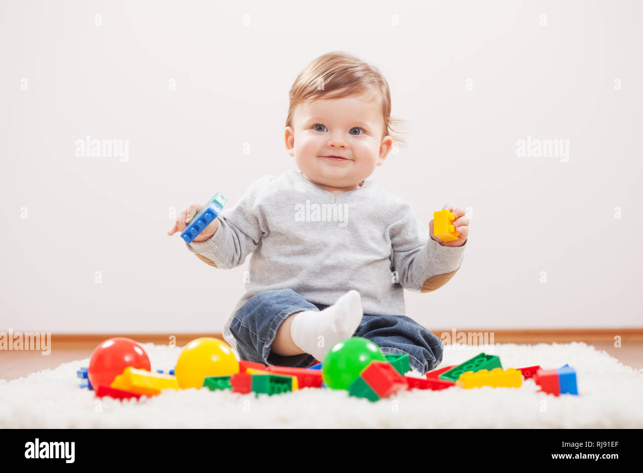 Baby 10 months blocks hi-res stock photography and images - Alamy