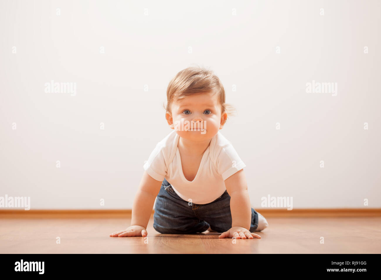Cute baby boy crawling Stock Photo - Alamy