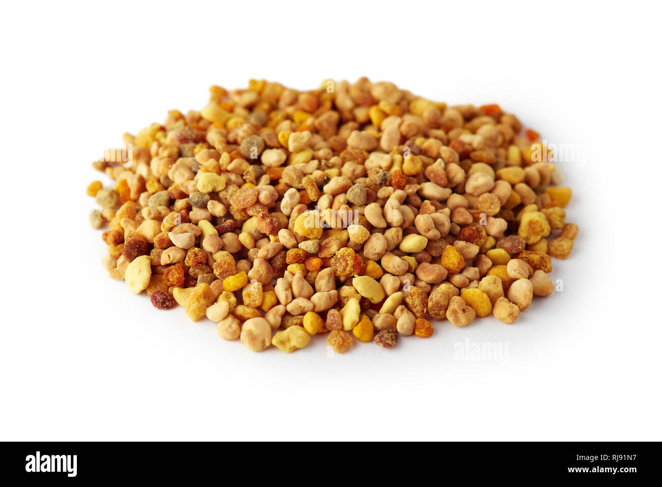 Pile of bee pollen grains isolated on white background Stock Photo - Alamy