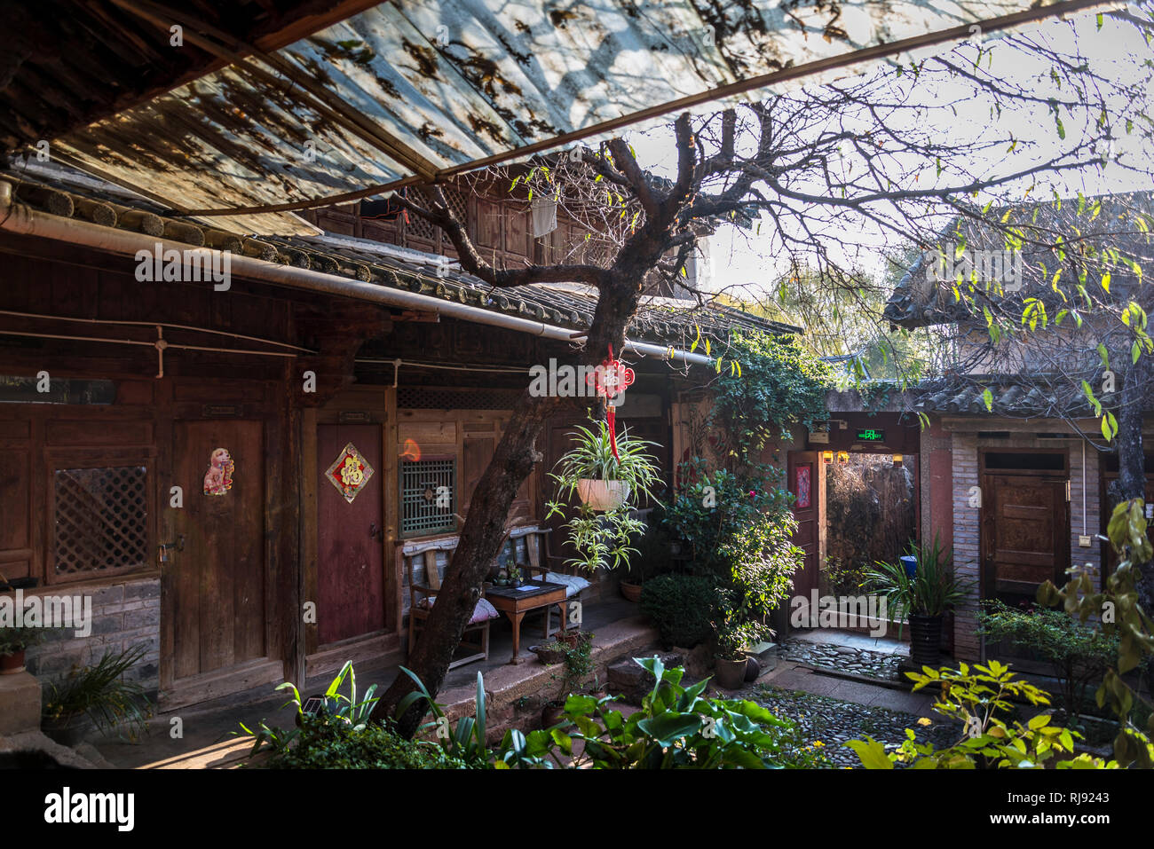 Interior courtyard of a traditional Bai house now serving as a hostel ...