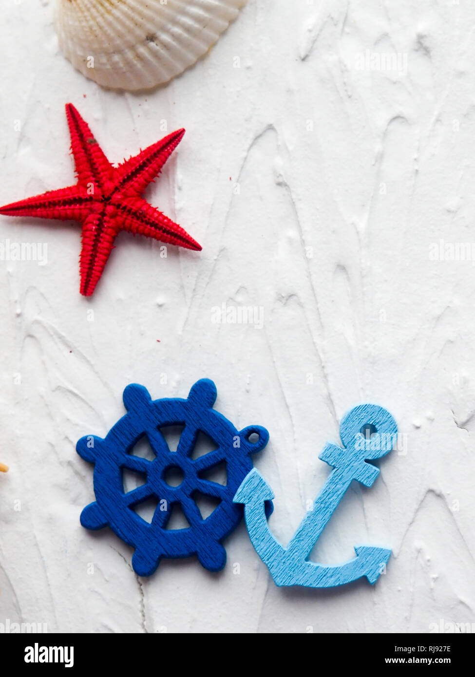 Background with decorative anchors and wheels on a white painted ...