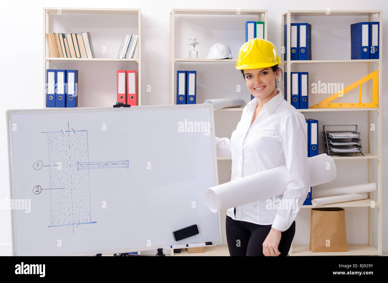 Female architect working in the office Stock Photo - Alamy