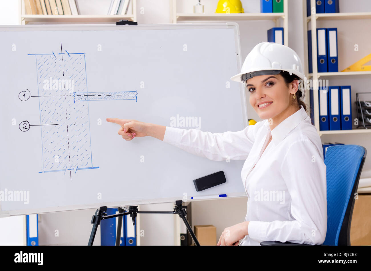 Female architect working in the office Stock Photo - Alamy