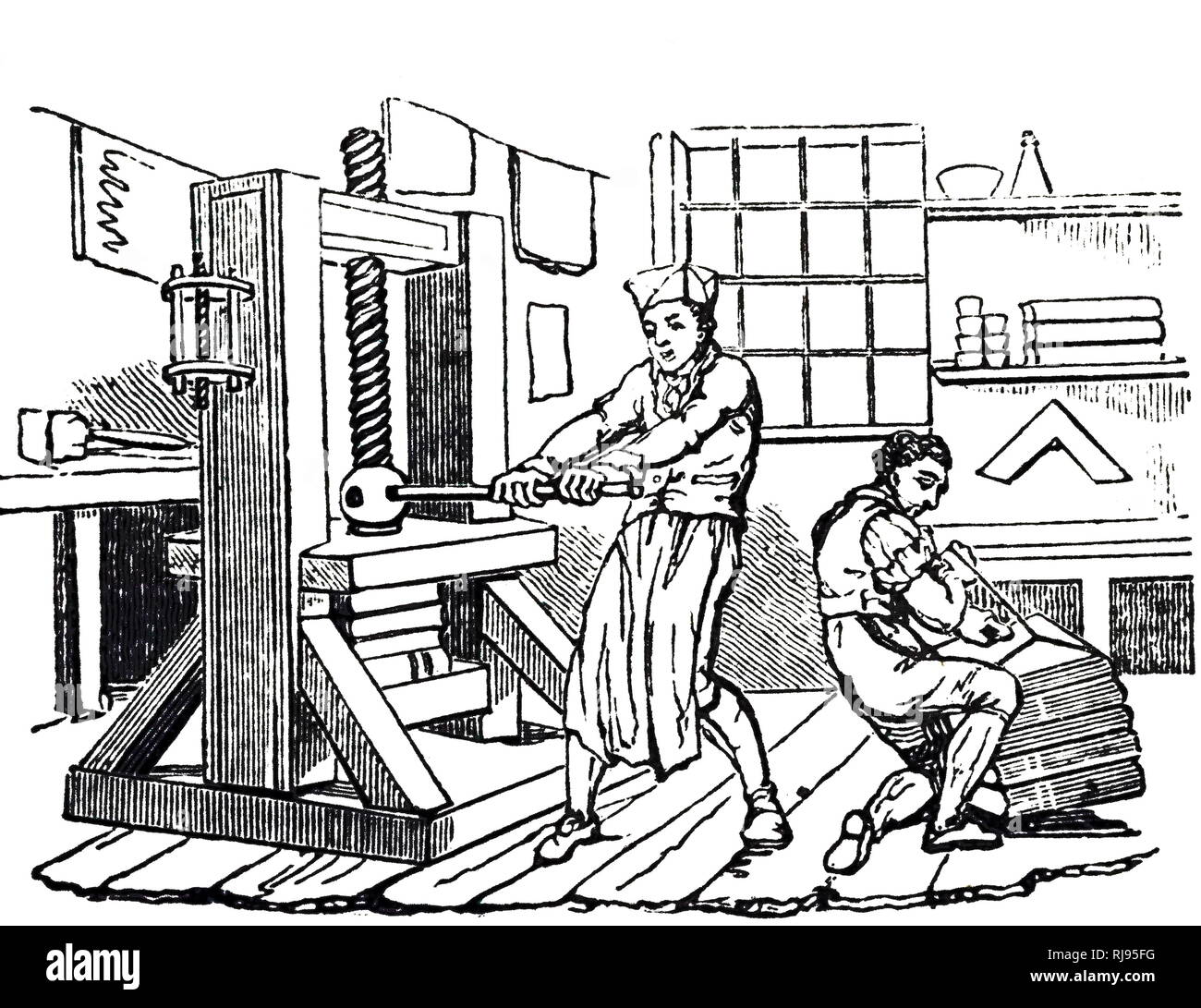 An engraving depicting a screw press containing newly bound books ...