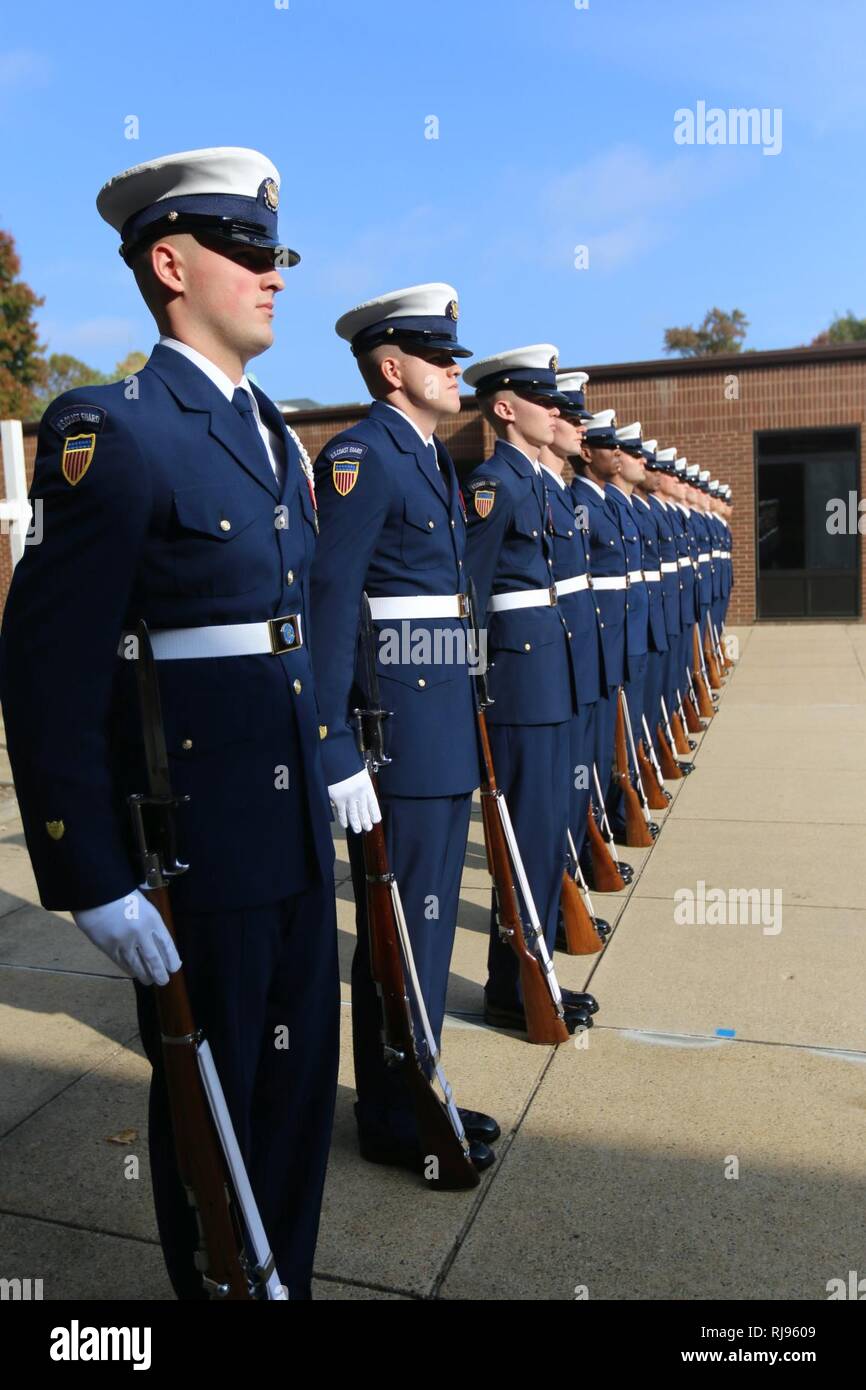 Members of the U.S. Coast Guard Ceremonial Honor Guard line up to be ...